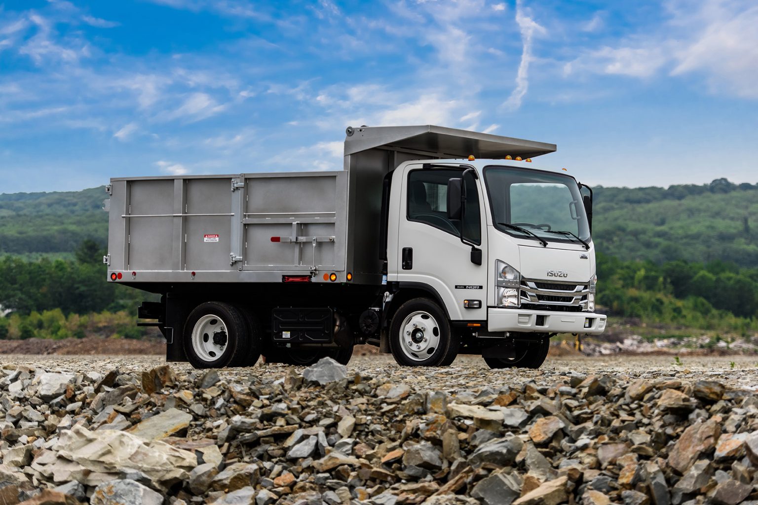 Isuzu NQR | Packer City & UP International Trucks